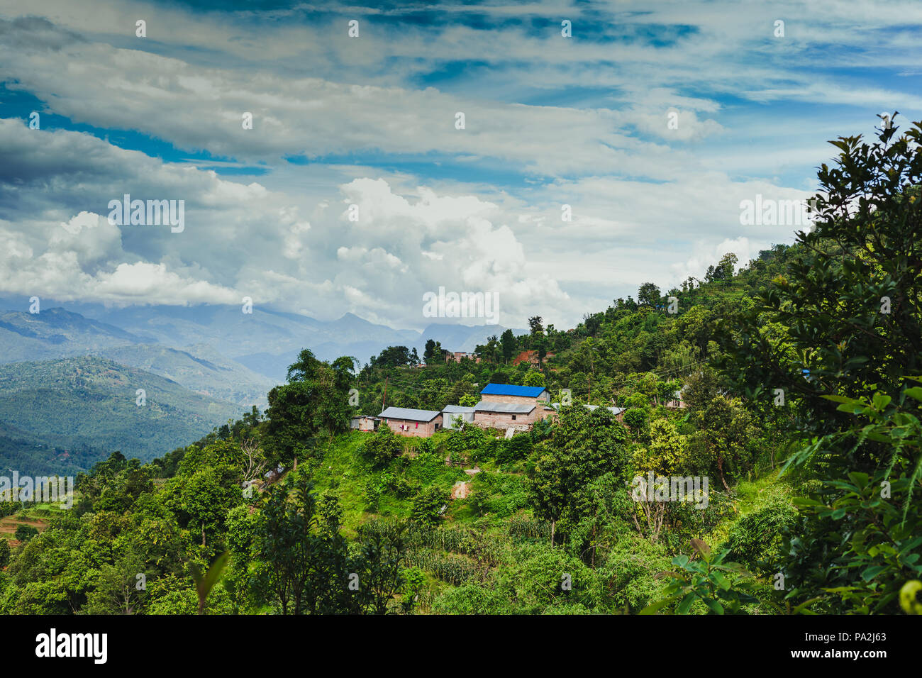 Scenery of beautiful Nepali rural village with mountains and green forest.It is in the hilly ...
