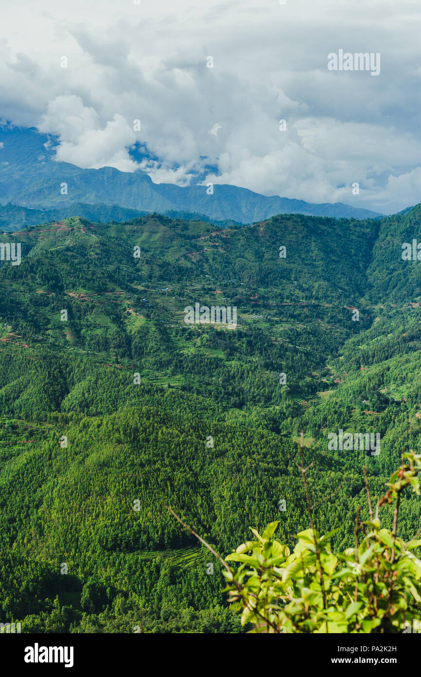 Scenery of beautiful Nepali rural village with mountains and green forest.It is in the hilly ...
