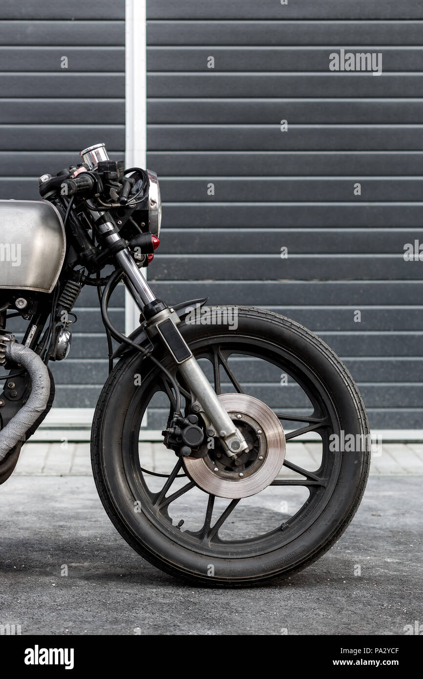 Custom motorcycle parking near industrial building. Everything is ready ...