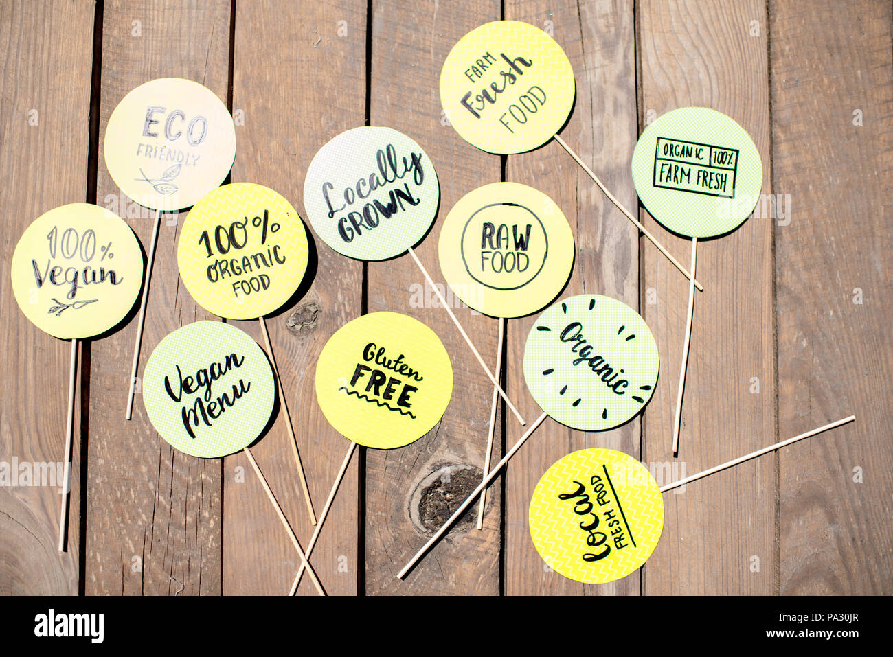 Green stickers with healthy food slogans on the wooden table Stock ...