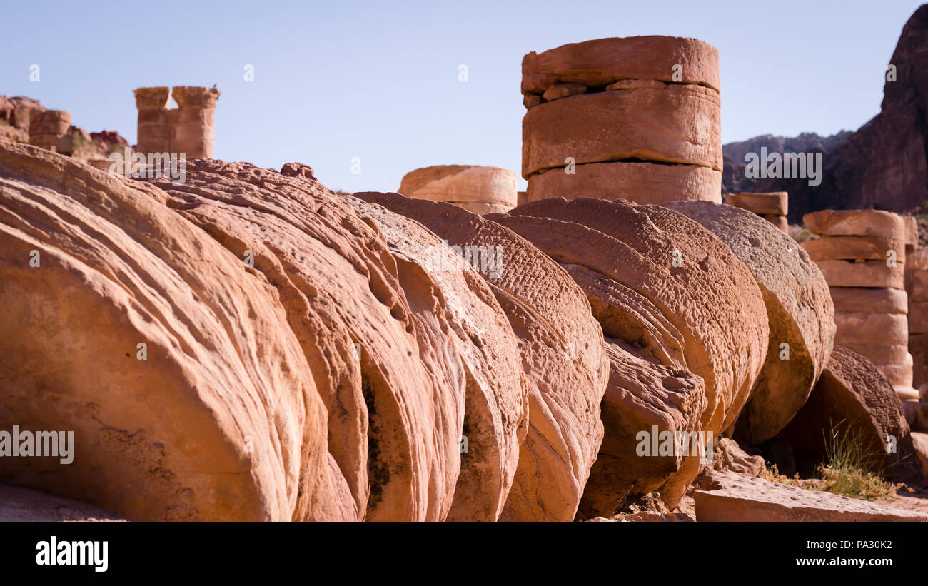 Fallen Roman temple columns in Petra canyon, Jordan Stock Photo - Alamy