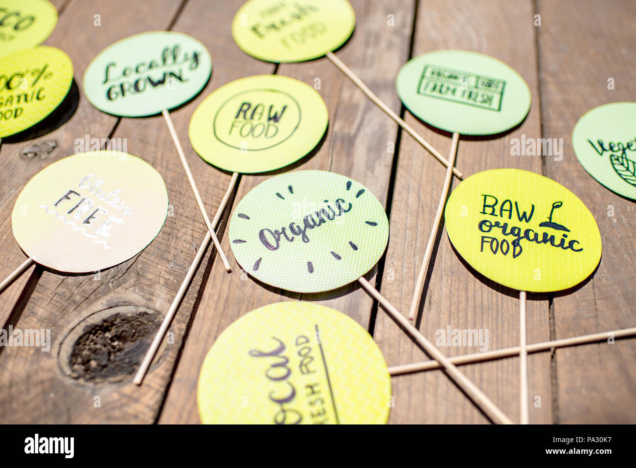 Green stickers with healthy food slogans on the wooden table Stock ...