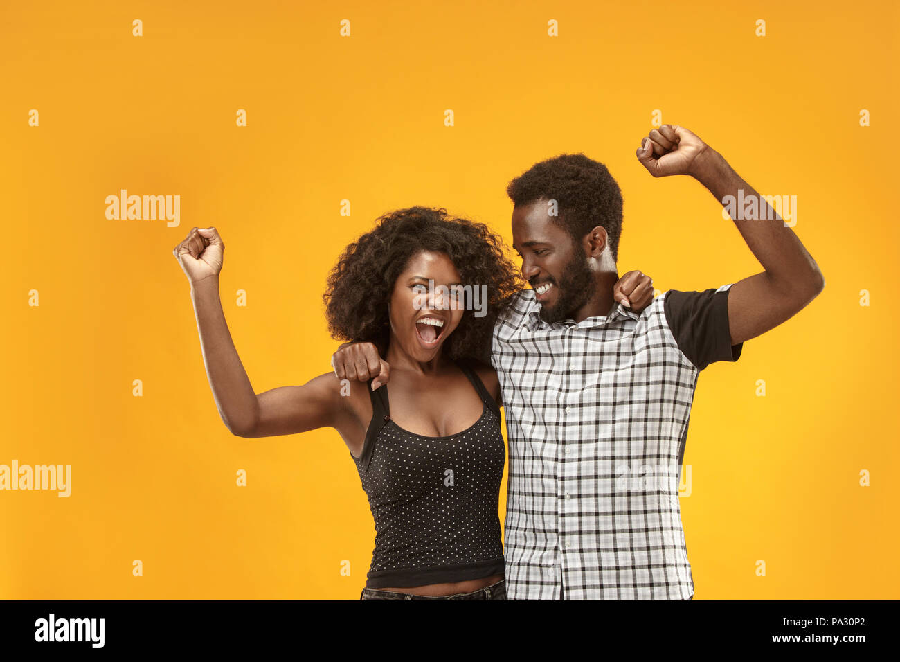 Winning success couple celebrating being a winner. Dynamic energetic ...