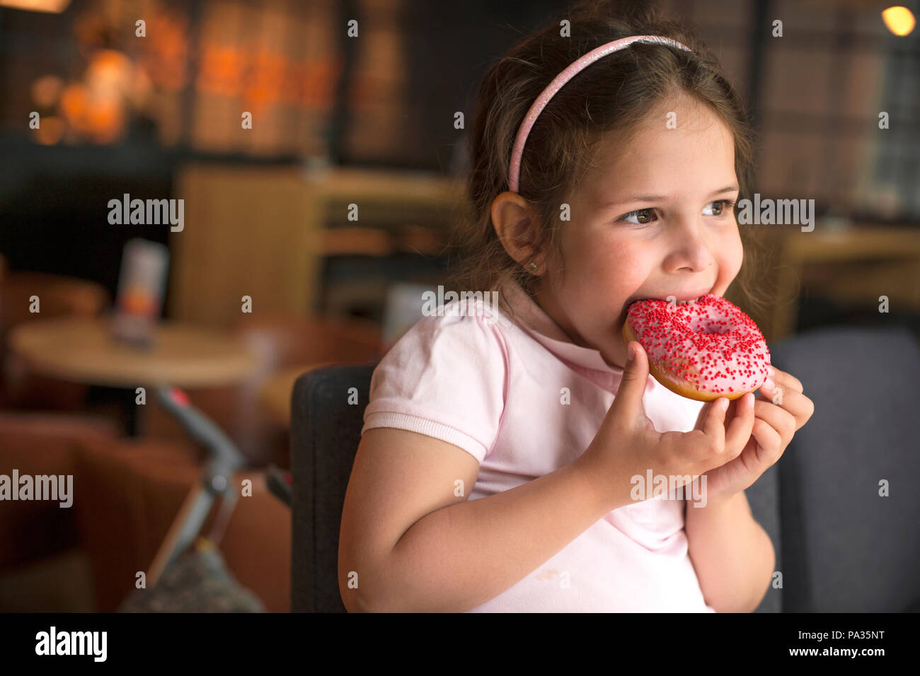 Child pastry eating cafe hi-res stock photography and images - Alamy