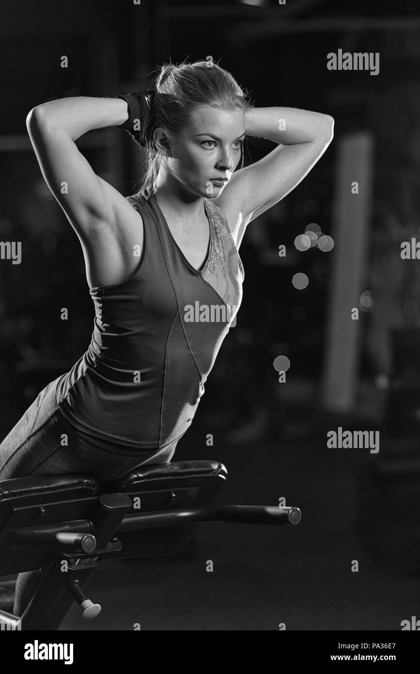 Woman doing strength exercises for abs muscles Stock Photo - Alamy