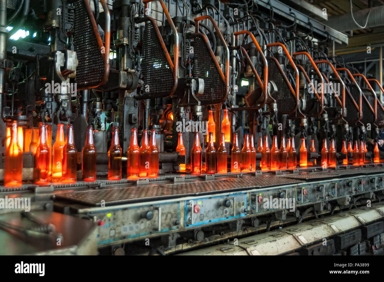 Automated line for the production of glass containers. The hot bottles ...