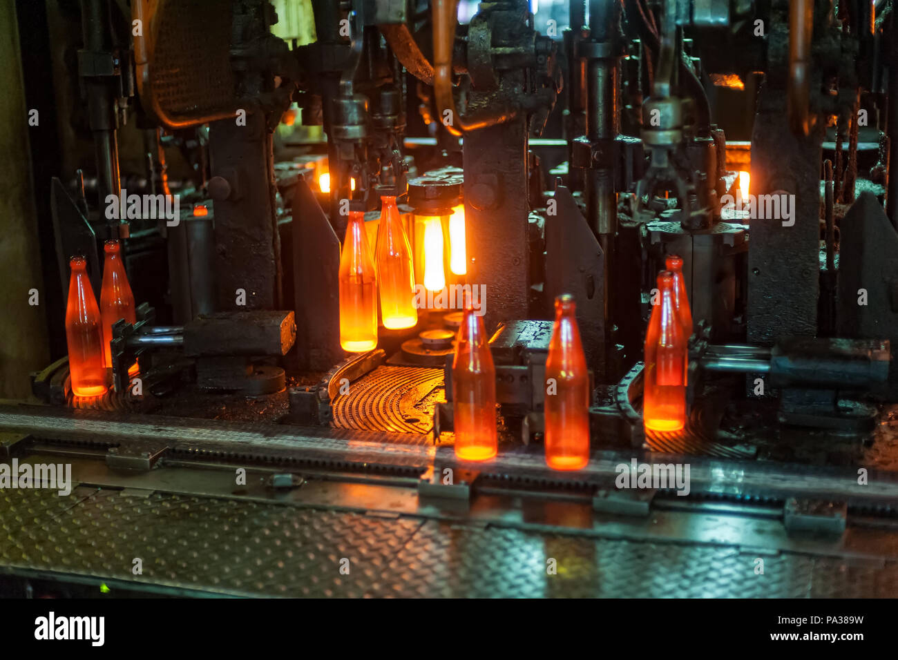 Automated line for the production of glass containers. The hot bottles ...