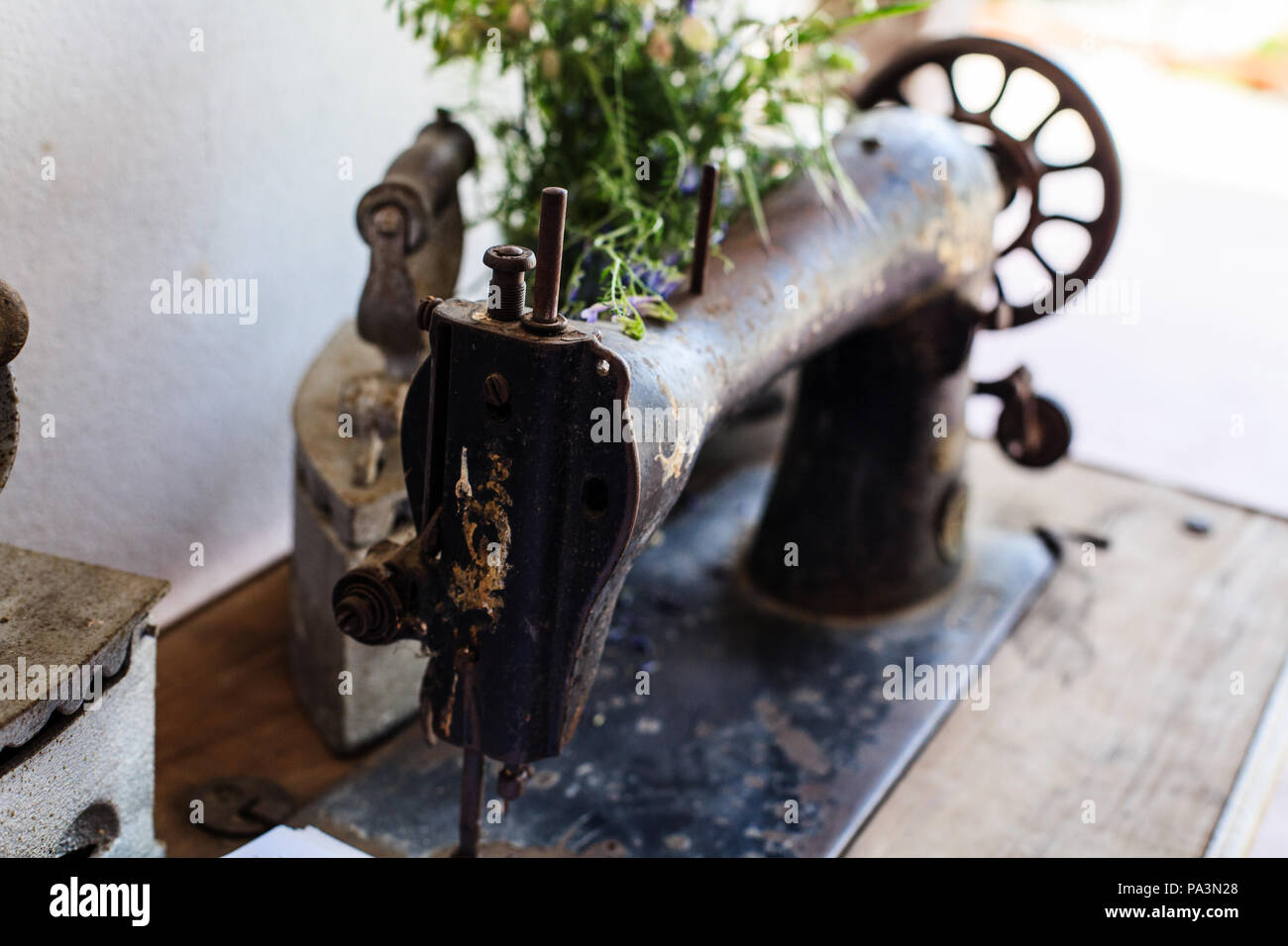 Old sewing machine, old-fashioned manufacturing Stock Photo - Alamy