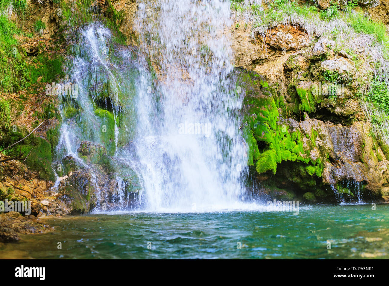 Beautiful waterfall in spring at daylight, forest stream creek,eastern ...