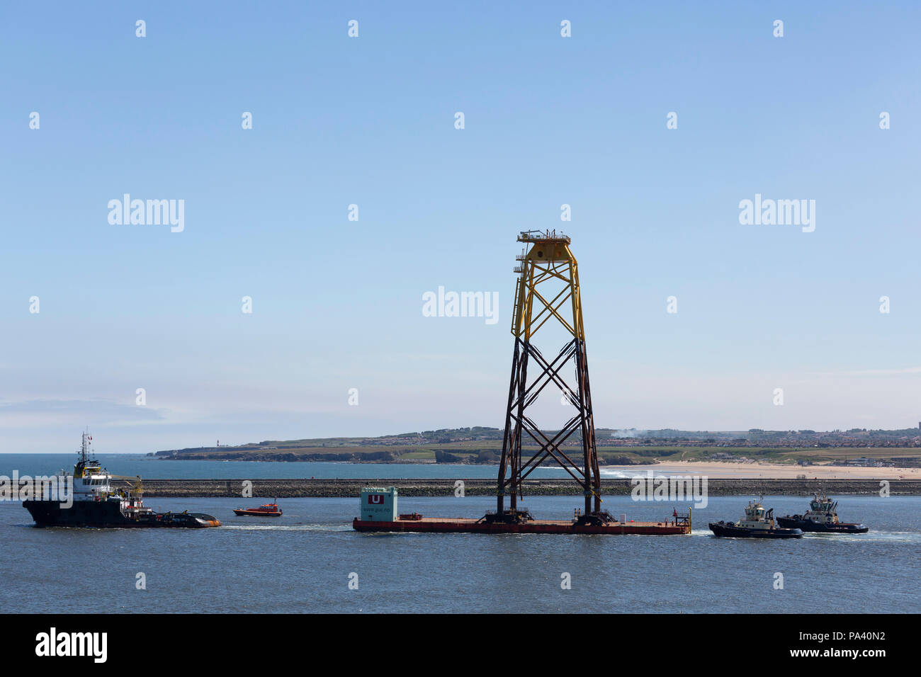 Offshore platform being towed to the mouth of the River Tyne at ...
