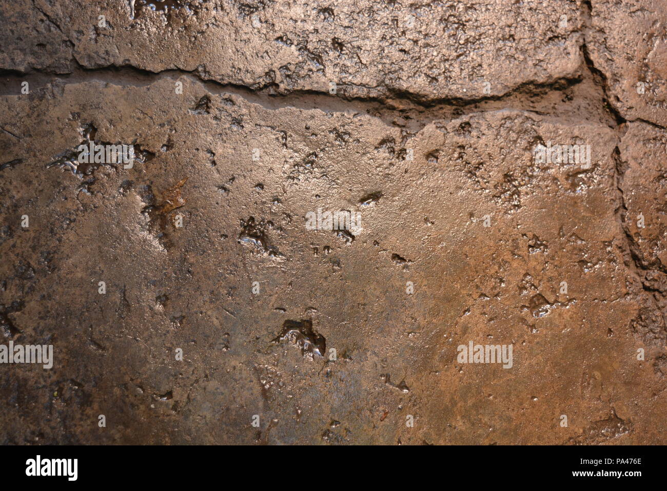 Building materials, wet concrete asphalt old after a rainstorm very ...