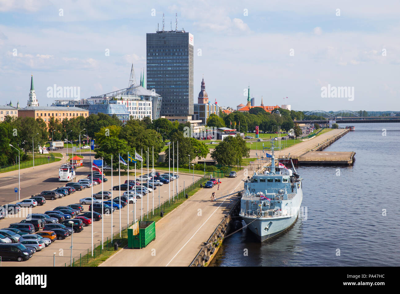 City Riga, Latvia. Ship at River Daugava, port and buildings. Urban ...