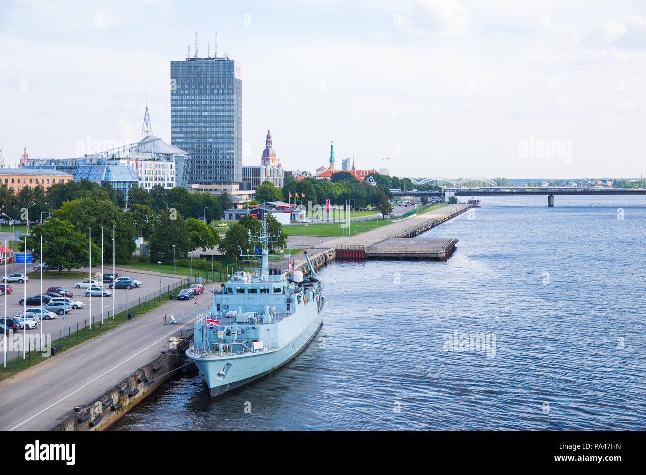 City Riga, Latvia. Ship at River Daugava, port and buildings. Urban ...