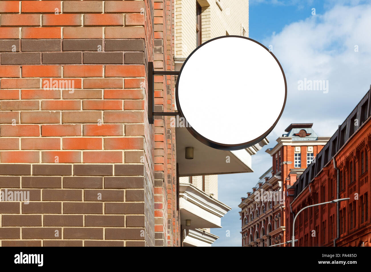 Blank shop sign om brick wall. Round signage mockup. 3d illustration ...