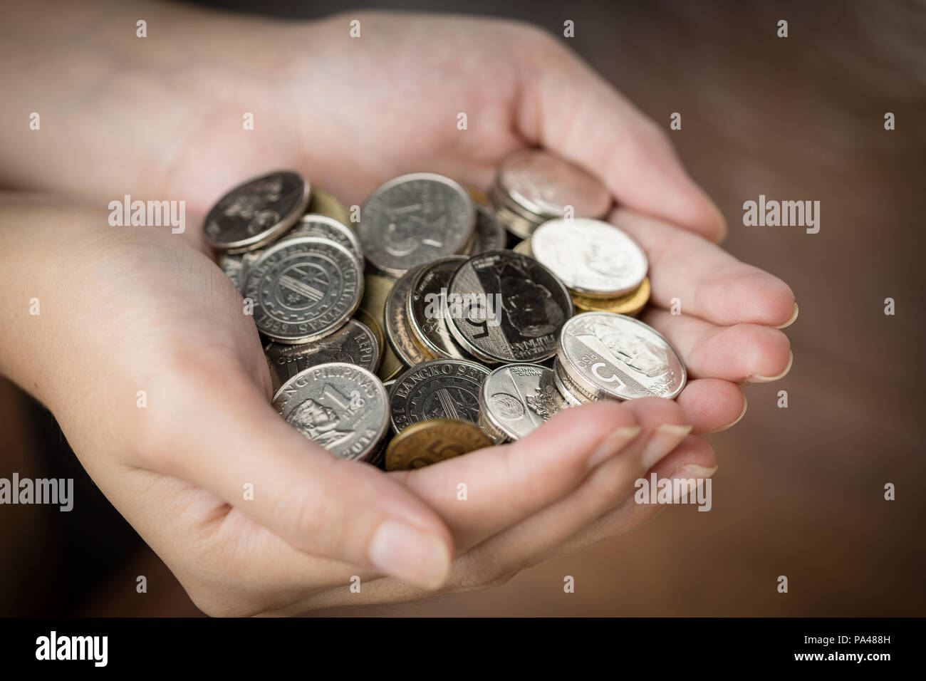 Philippine peso coins hi-res stock photography and images - Alamy