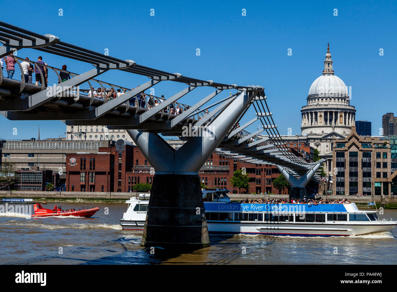 A London Eye River Cruise Boat Passes Under The Millennium Bridge On ...