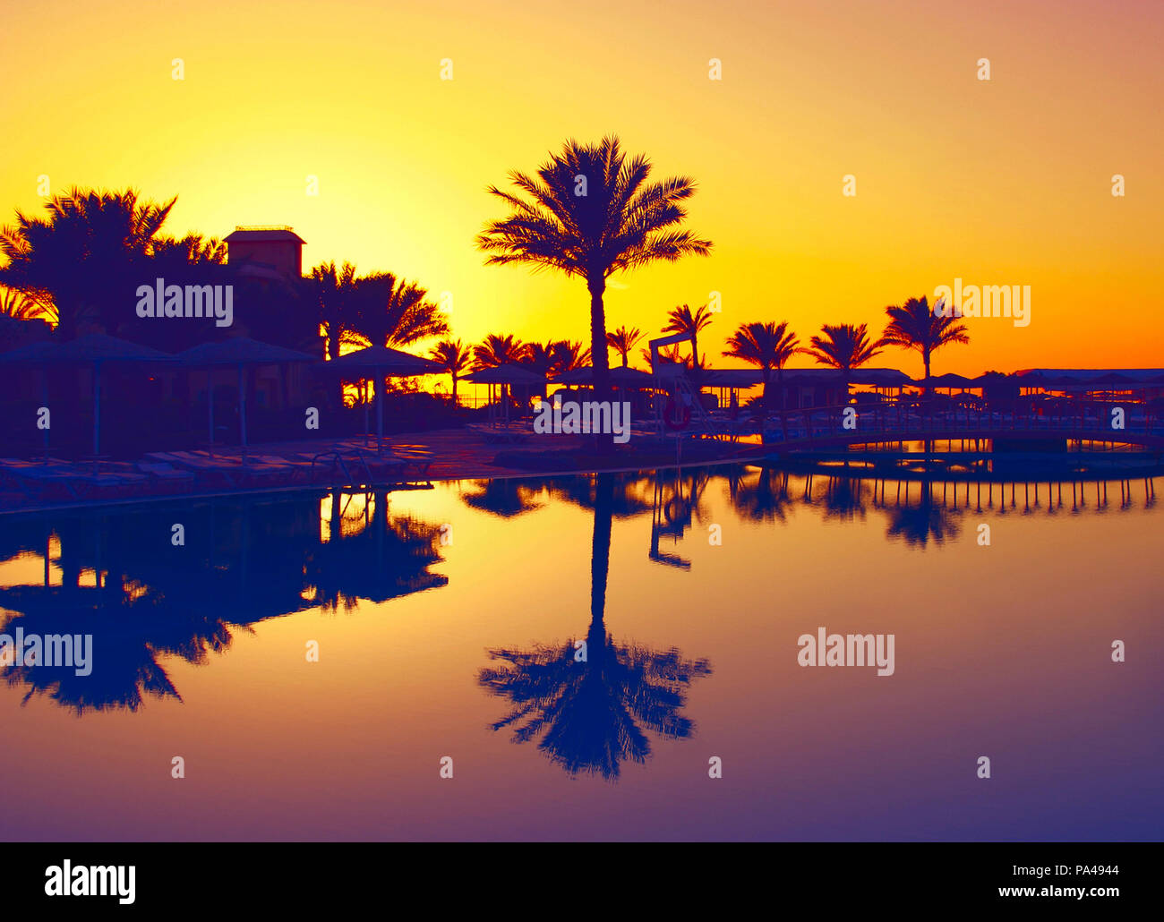 A photography of a pool view with sunset Stock Photo - Alamy