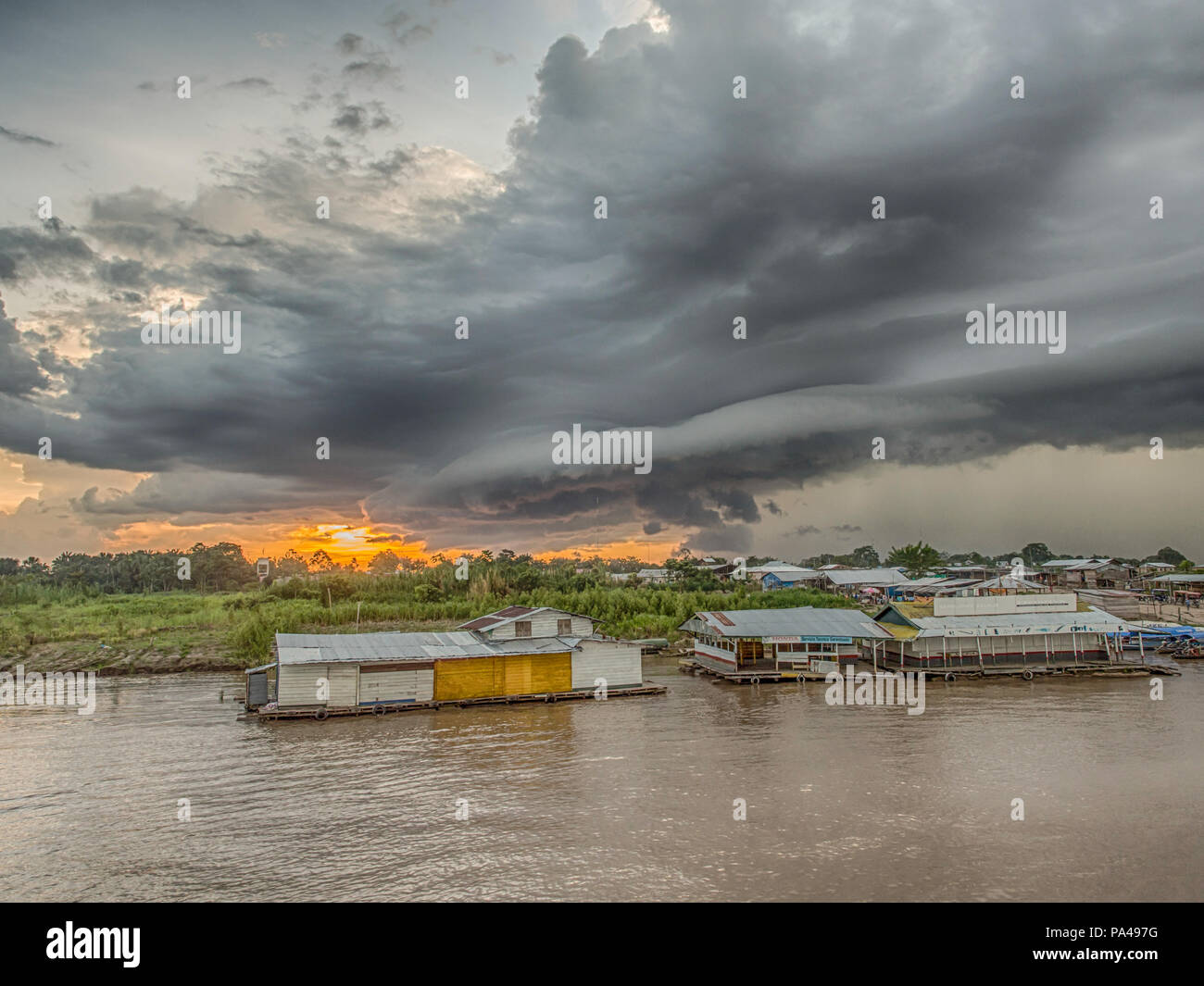 Sunset and dramatic clouds before the storm on the sky over the Amazon ...