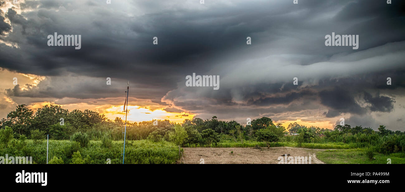 Sunset and dramatic clouds before the storm on the sky over the Amazon ...