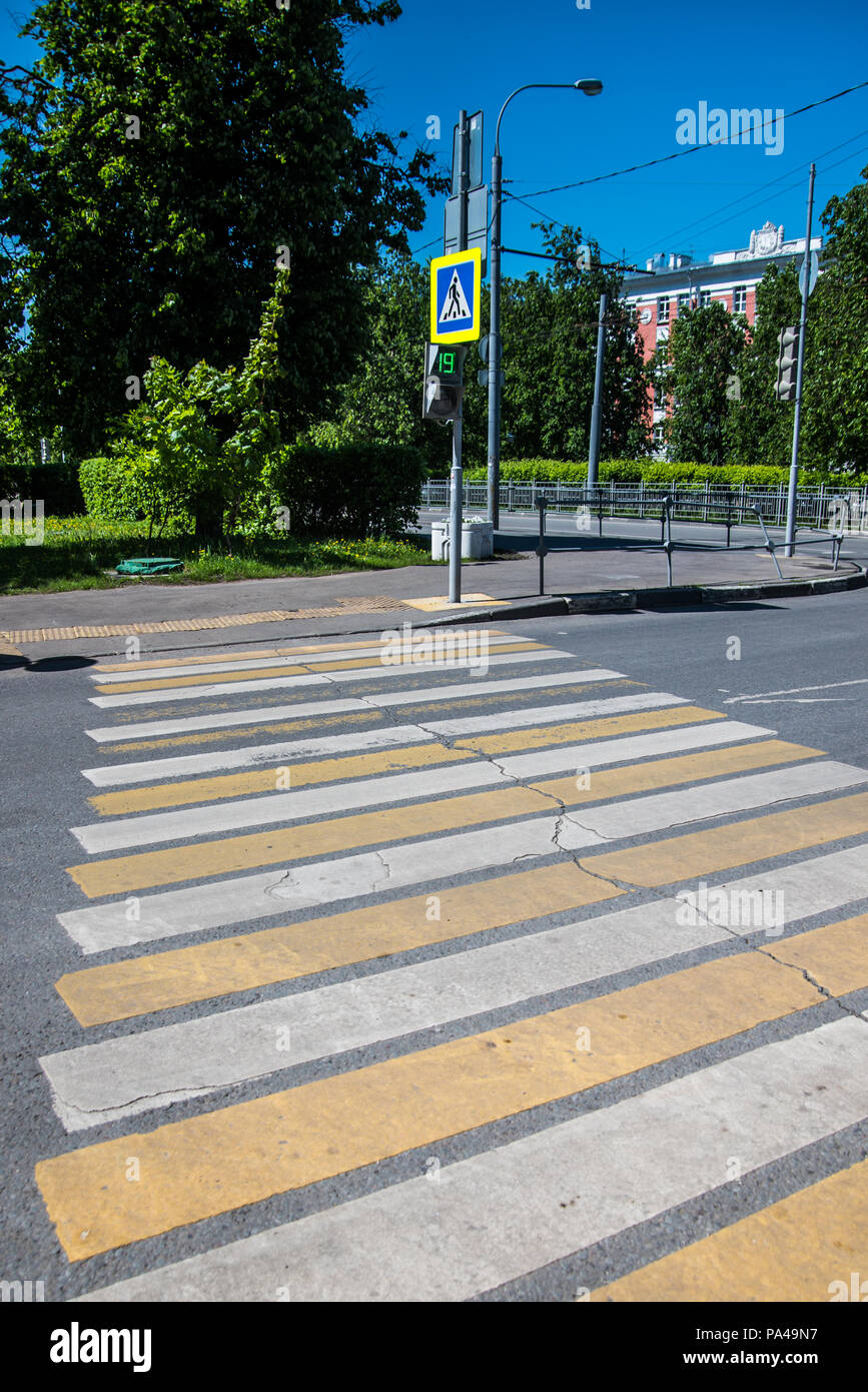 Yellow and white empty zebra pedestrian crossing Stock Photo - Alamy