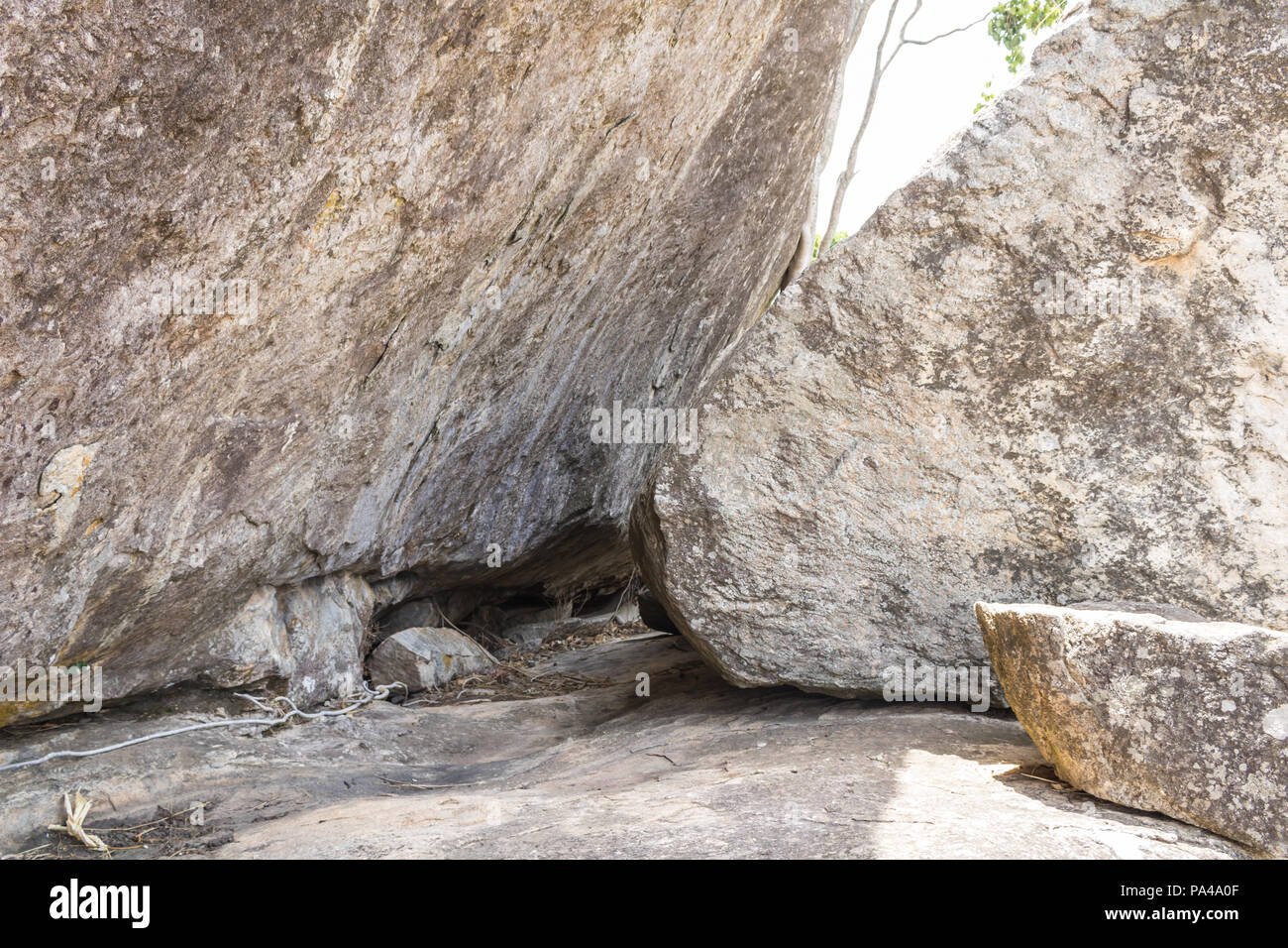 Massive rock outcrop with a cave formation hi-res stock photography and ...