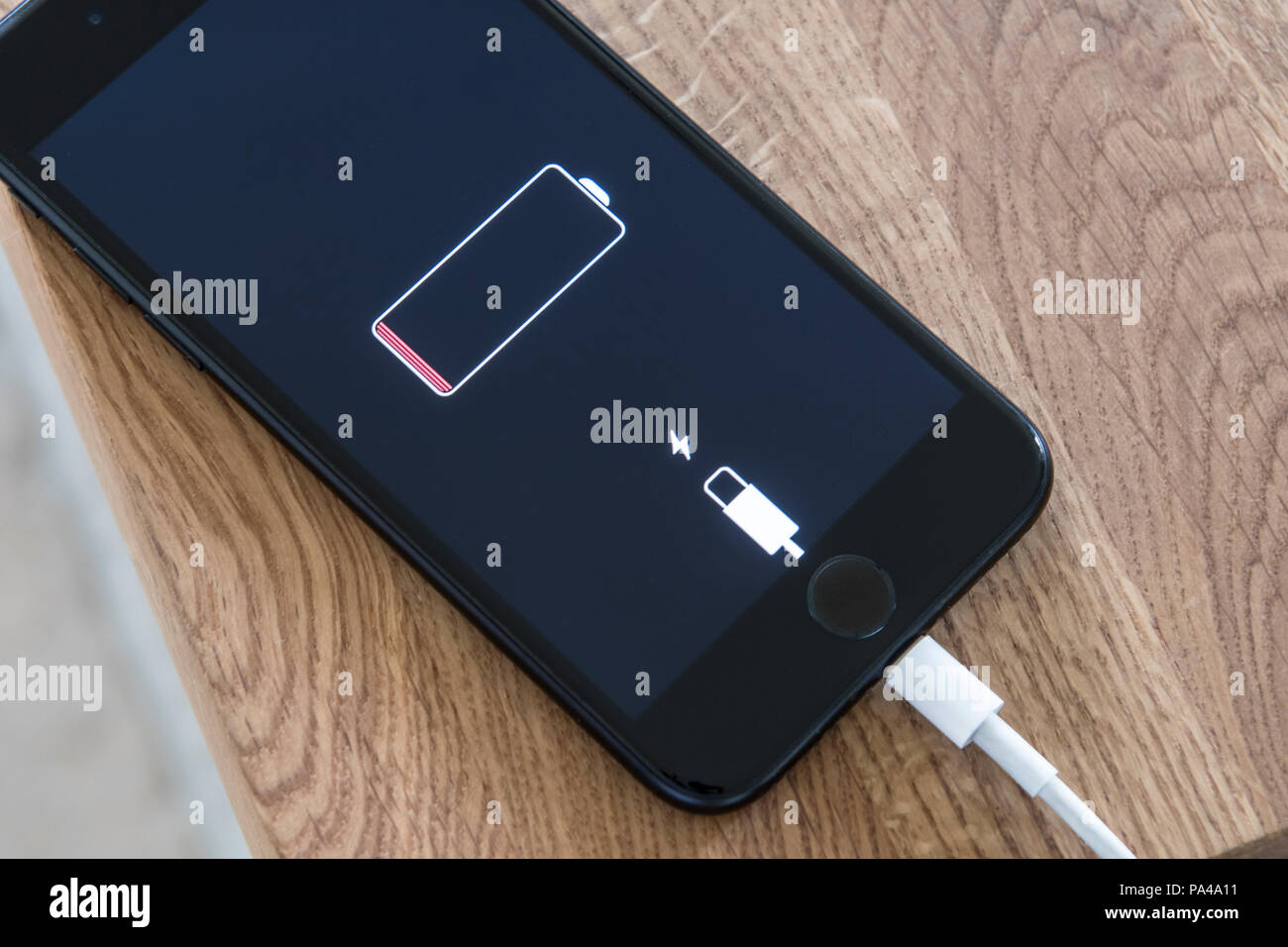 Mobile phone being charged up Stock Photo - Alamy