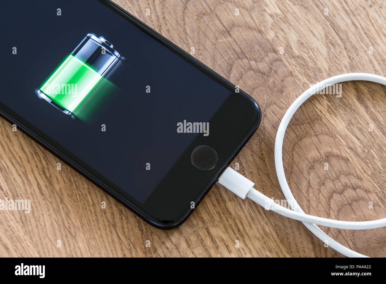 Mobile phone being charged up Stock Photo - Alamy