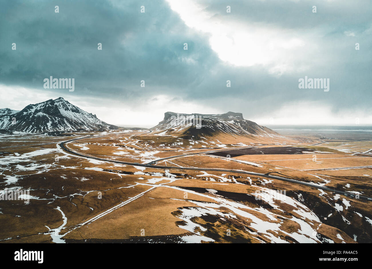 Iceland aerial view Landscape with snow and clouds, street and yellow ...