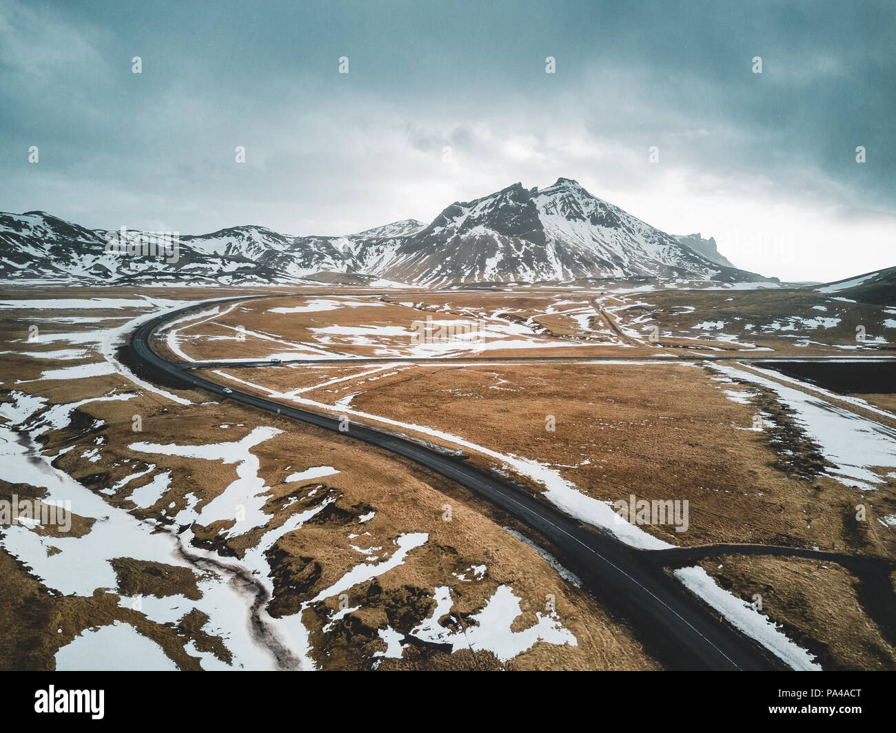 Iceland aerial view Landscape with snow and clouds, street and yellow ...