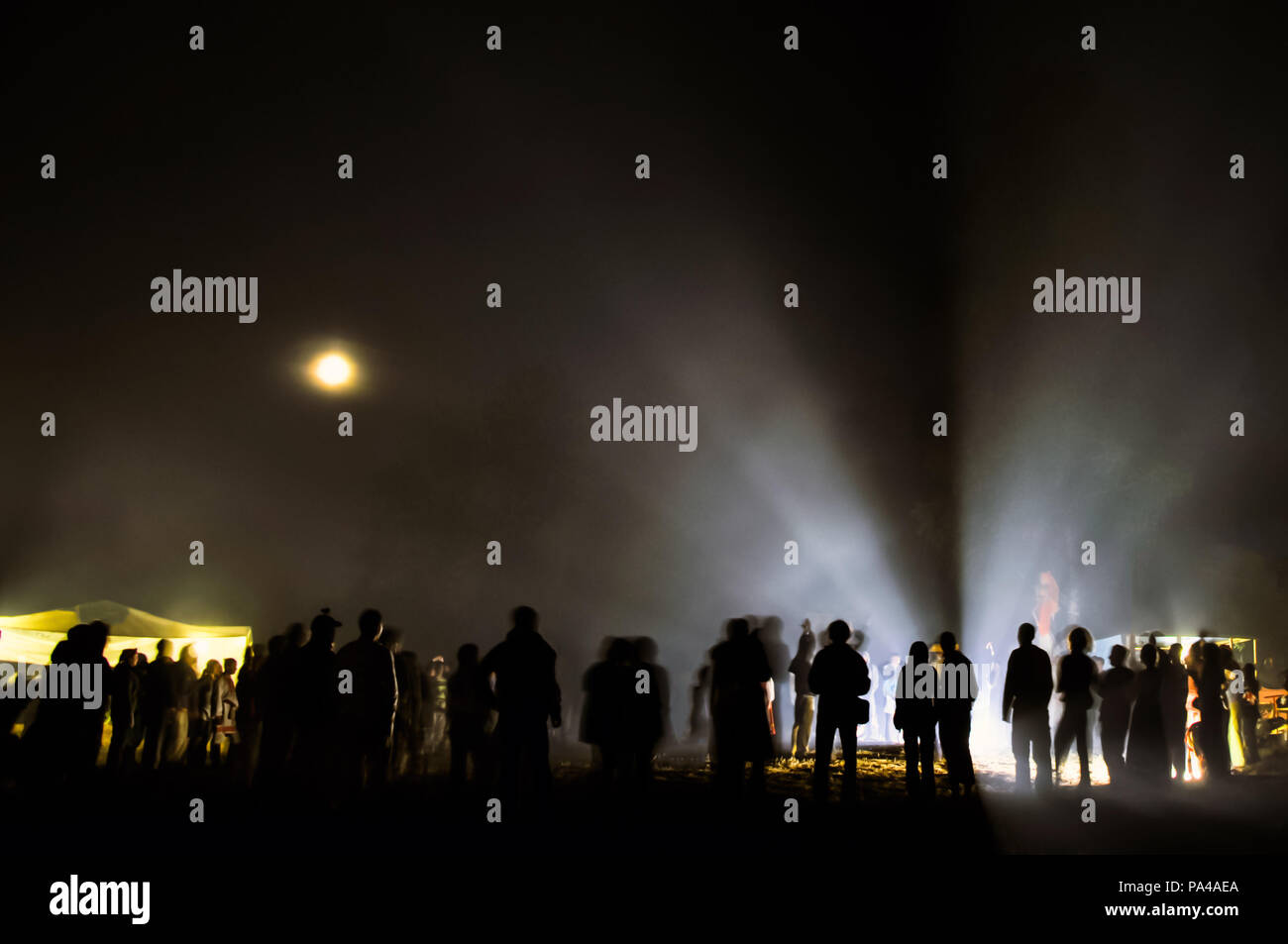 Big night party in forest at night. silhouette people Stock Photo - Alamy
