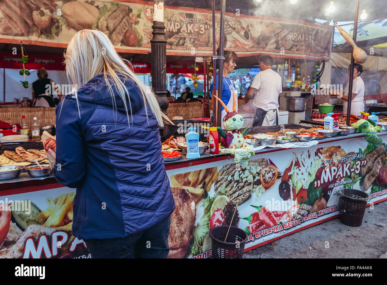 Food tent during famous annual Trumpet Festival in Guca village, Serbia ...