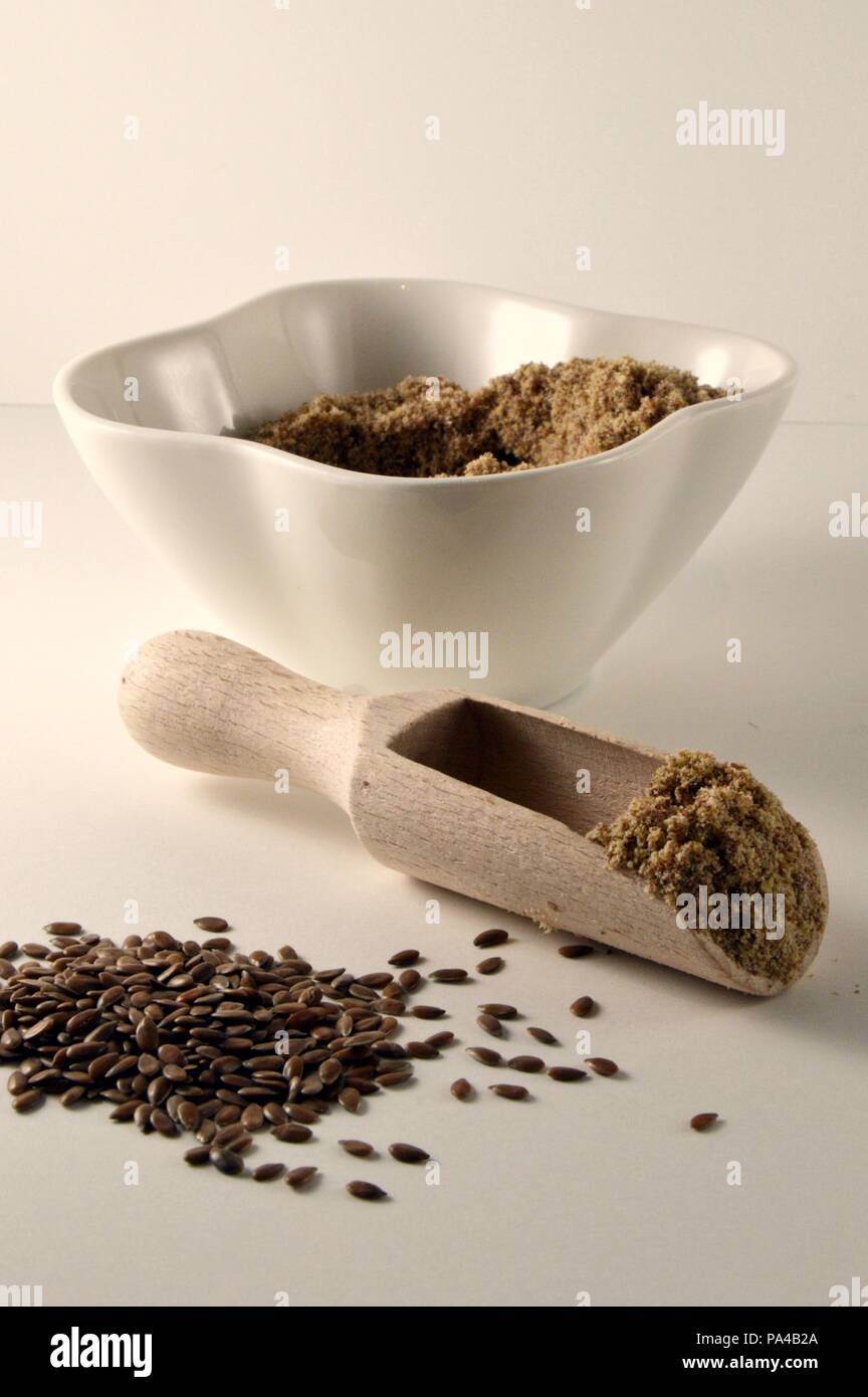 ground and whole linseeds (flax seeds) on white background Stock Photo ...