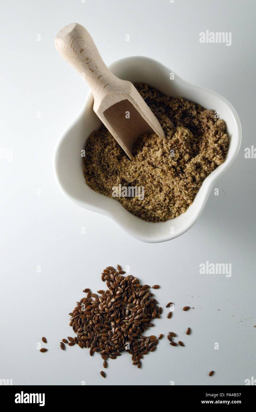 ground and whole linseeds (flax seeds) on white background Stock Photo ...