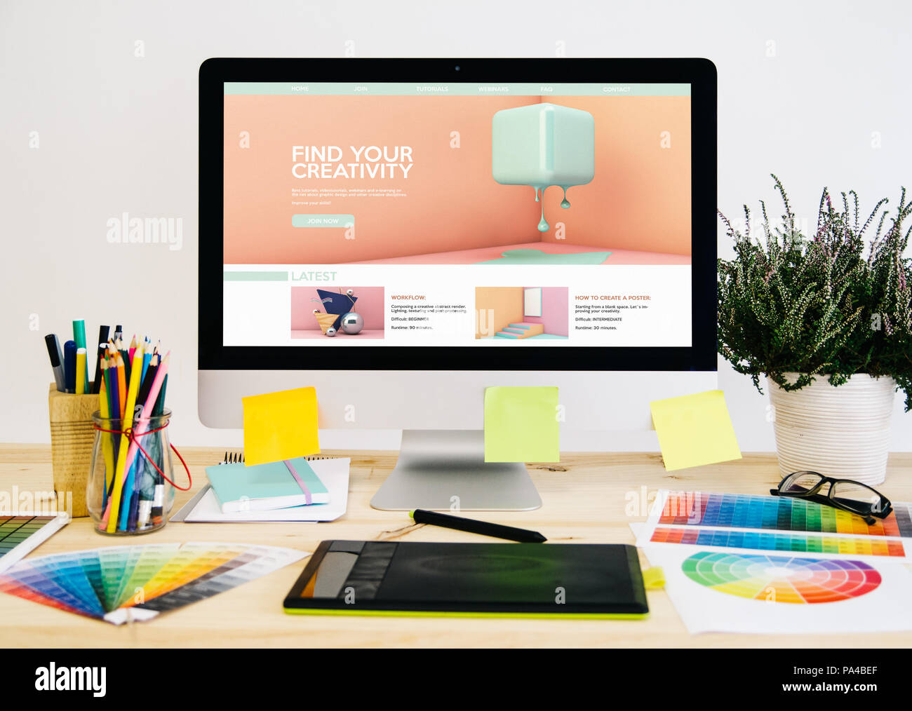 Stationery desktop with design stuff, computer and graphic tablet ...