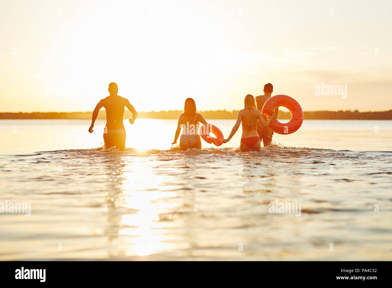 Group of young people in swimsuits hi-res stock photography and images ...