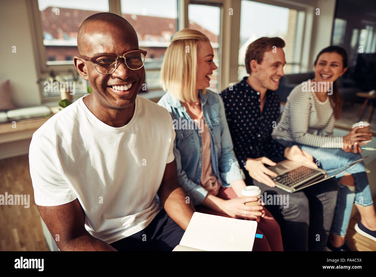 Sitting down in the workplace hi-res stock photography and images - Alamy