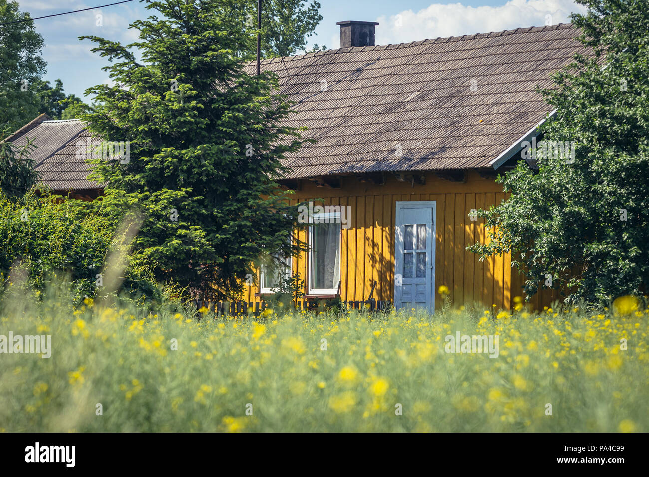 Wooden cottage, characteristic for Polish villages Stock Photo - Alamy