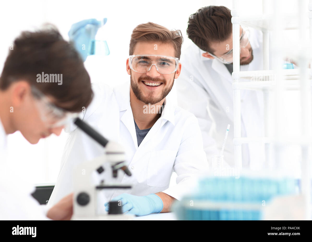 male biologist on blurred background colleagues Stock Photo - Alamy
