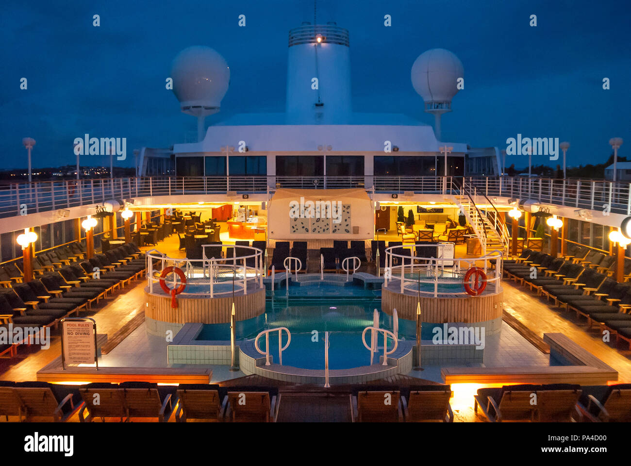 Luxury cruise ship pool at dusk Stock Photo - Alamy