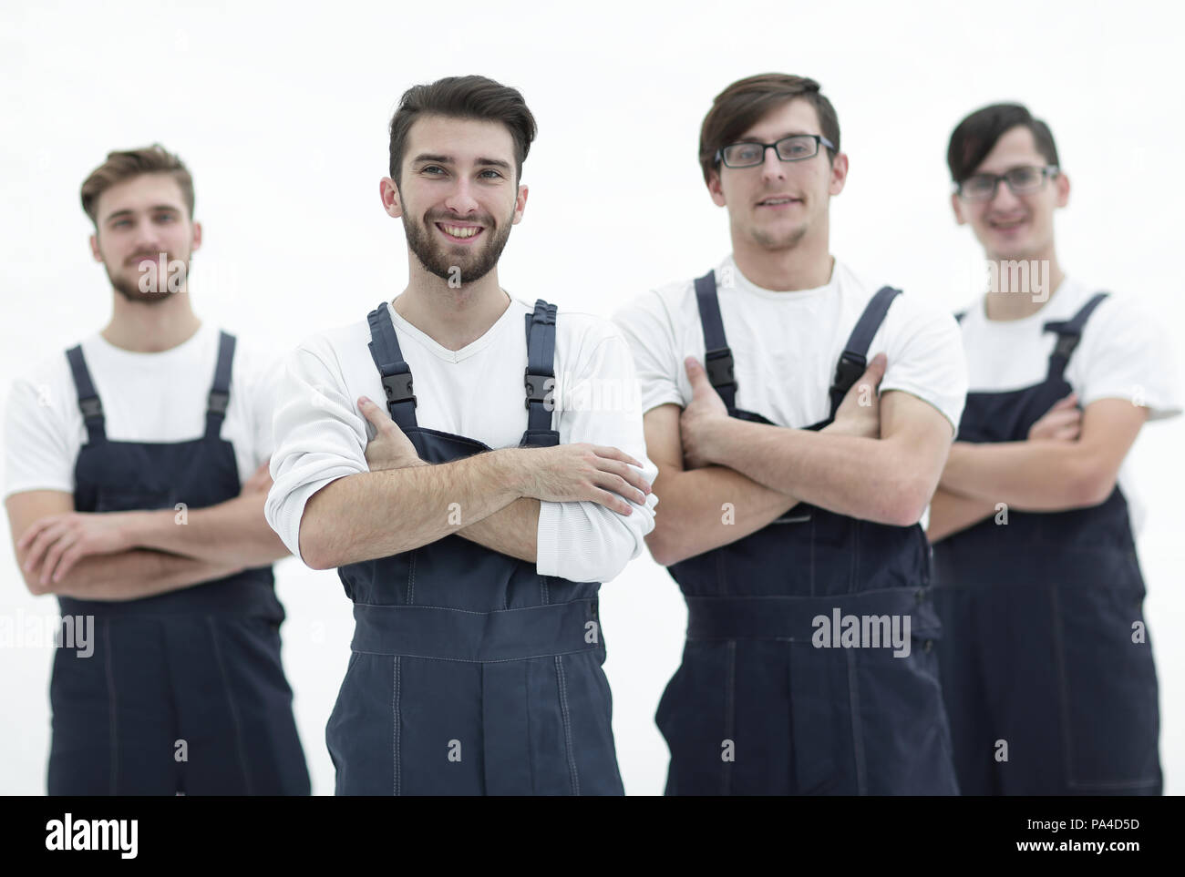 Happy team of responsible movers and their smiling leader Stock Photo ...