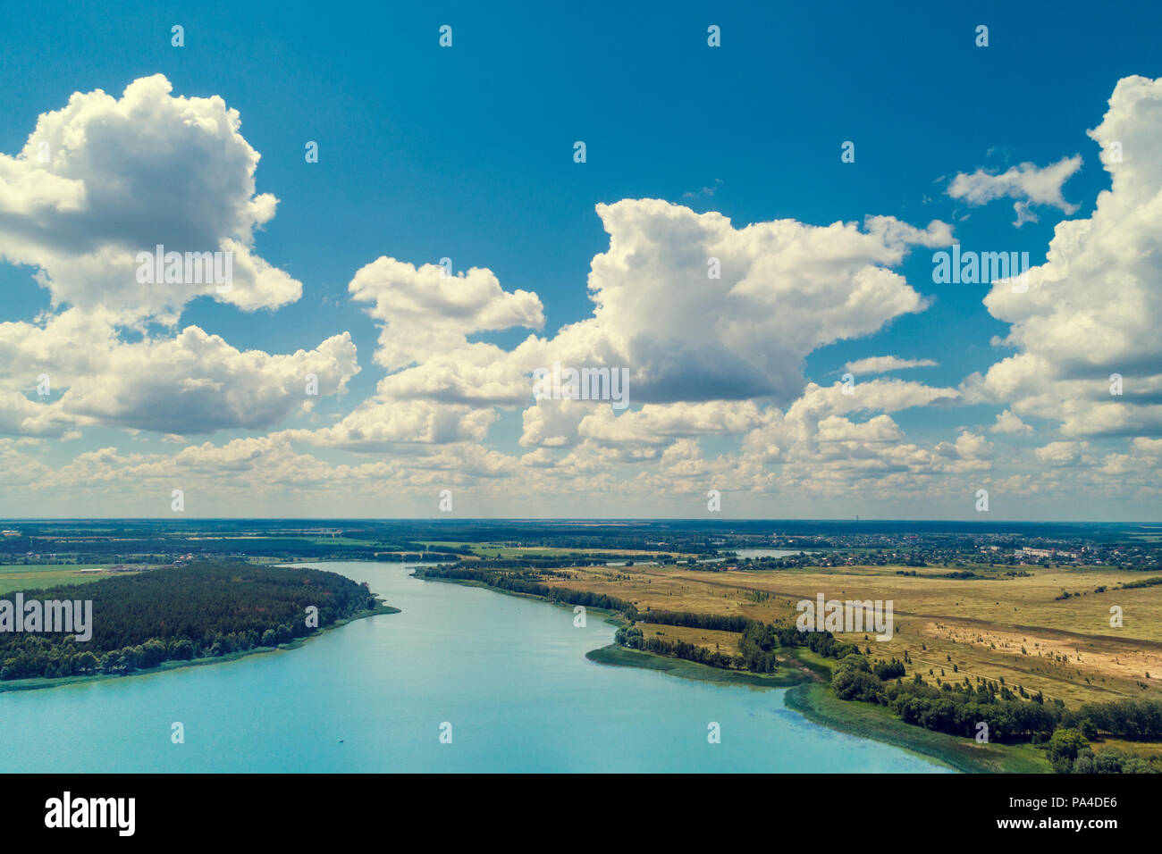 Aerial view of countryside and river. Blue sky with beautiful clouds ...