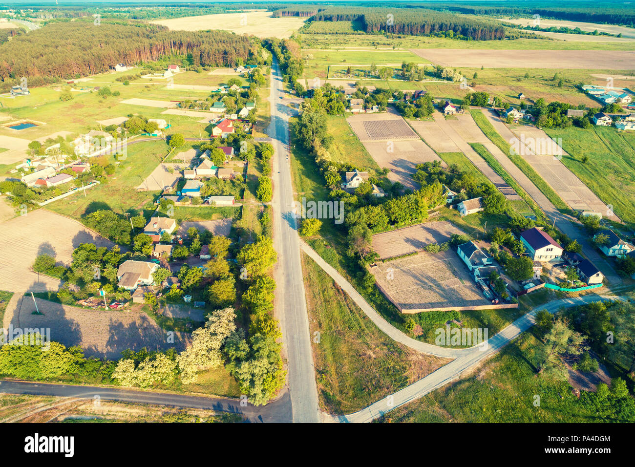 Aerial view of countryside, village, country road and fields. Rural ...