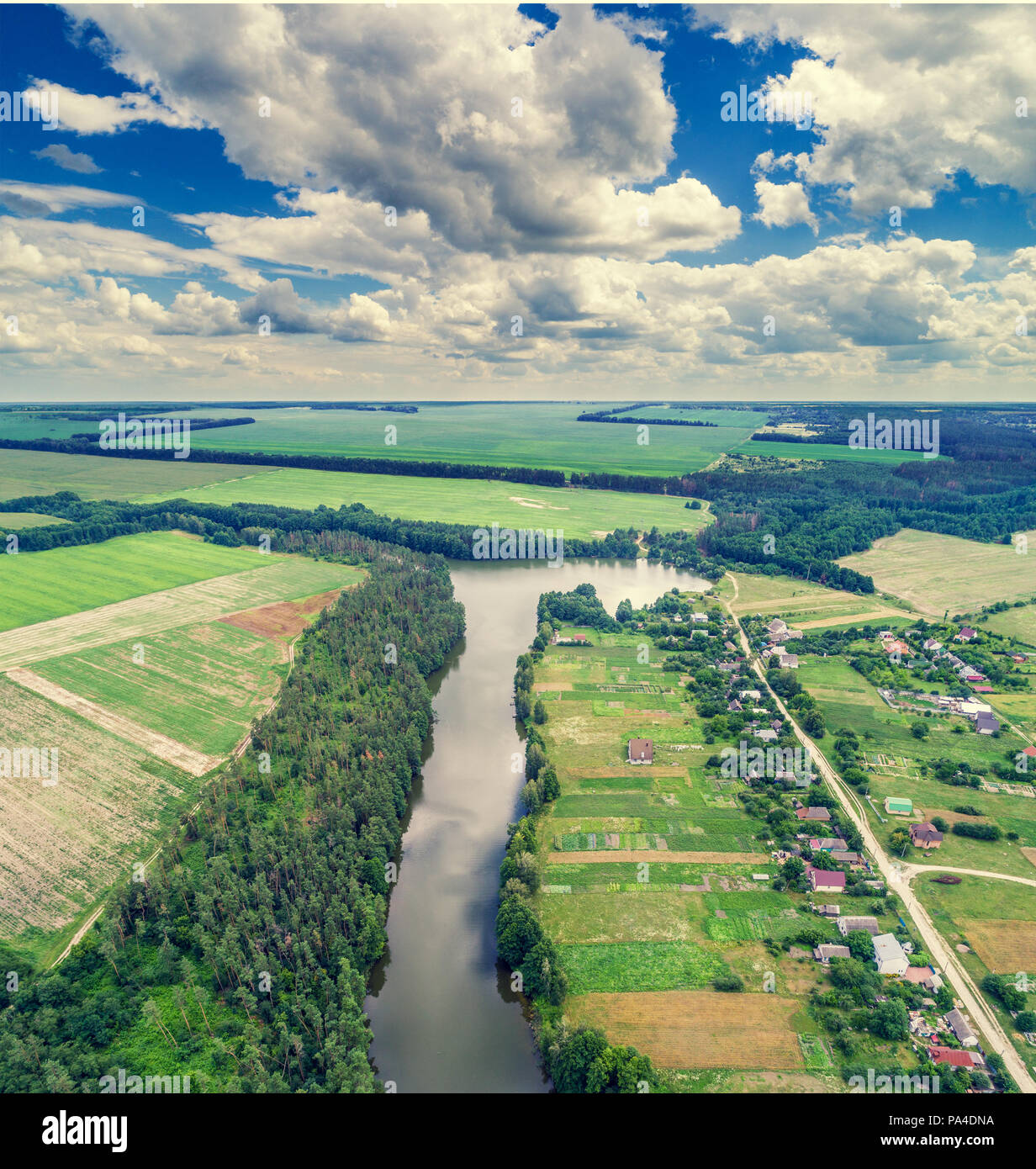 Aerial view of countryside and river with a beautiful sky. Forest and ...