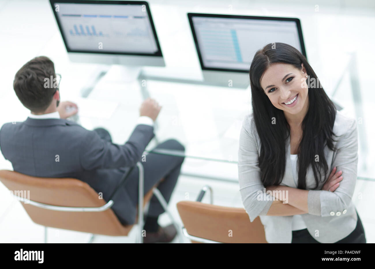 Successful business woman standing near hi-res stock photography and ...