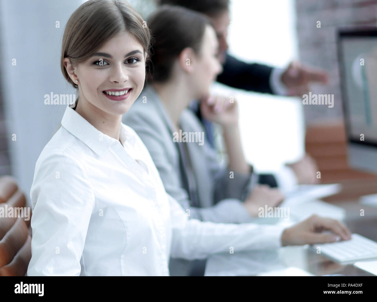 young employee sitting at a Desk Stock Photo - Alamy