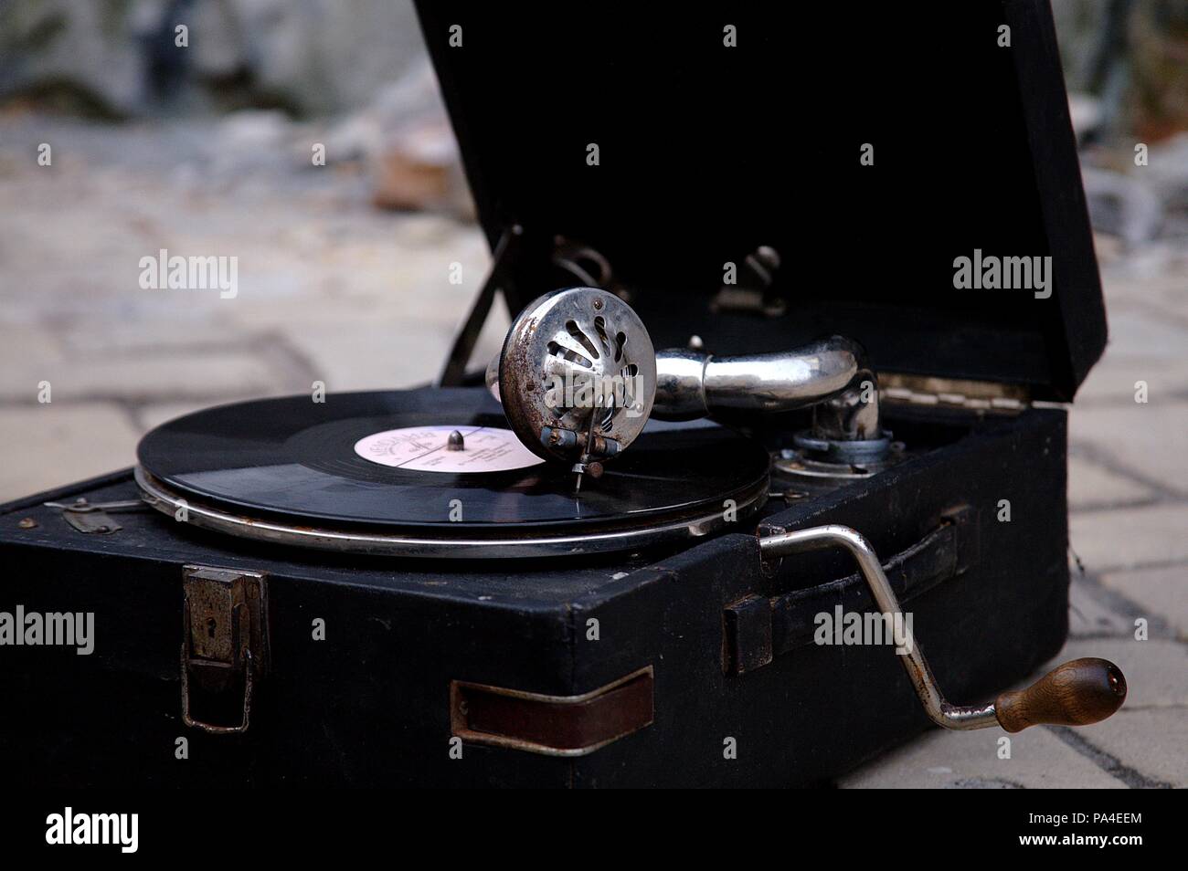 Portable vintage vinyl player in a black case for sale on a flea market ...