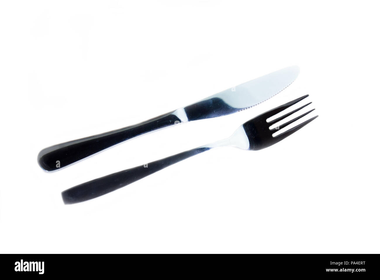 Metal fork and knife on a white background viewed from above Stock ...