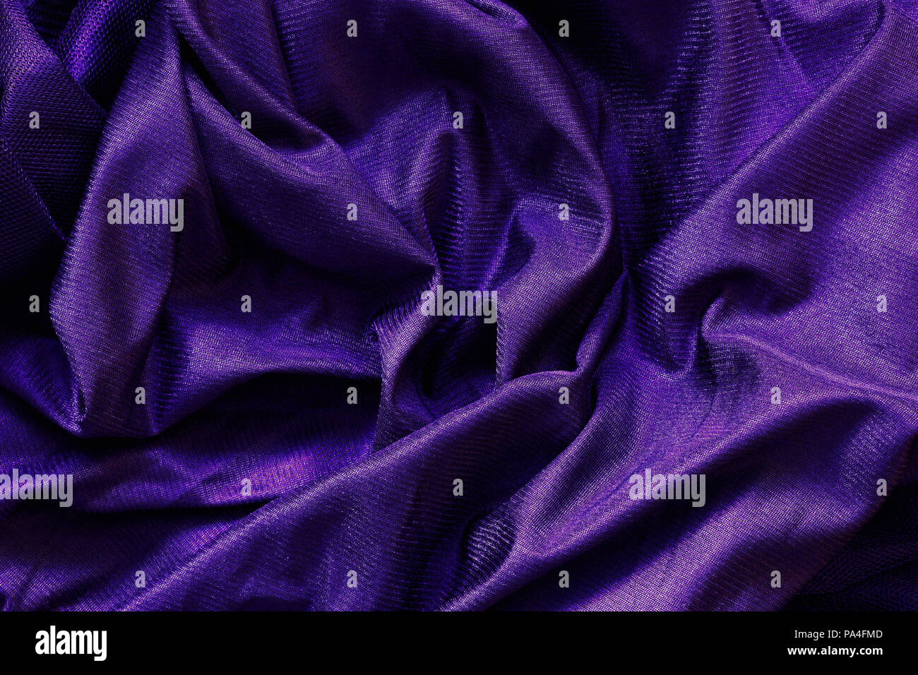 Closeup ultra violet macro texture of shiny smooth material fabric ...