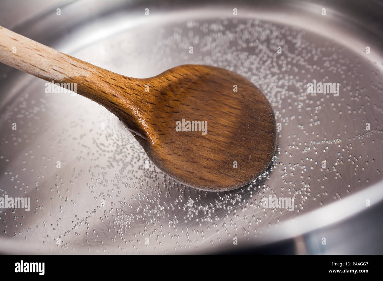 Wooden Cooking Spoon In A Stainless Pot With Boiling Water Stock Photo ...