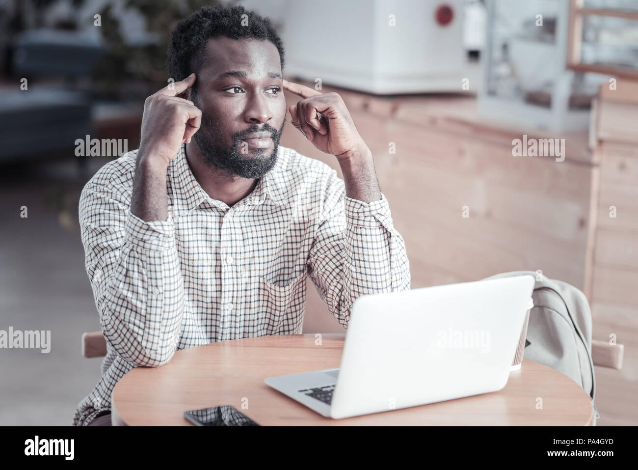 Man touching temples hi-res stock photography and images - Alamy